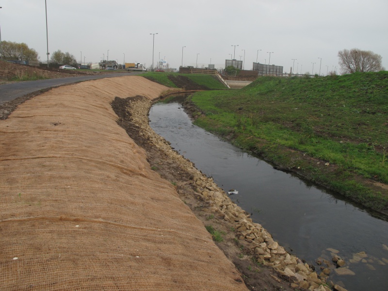 File:11 Eroded area with stone and geotextile.JPG - RESTORE
